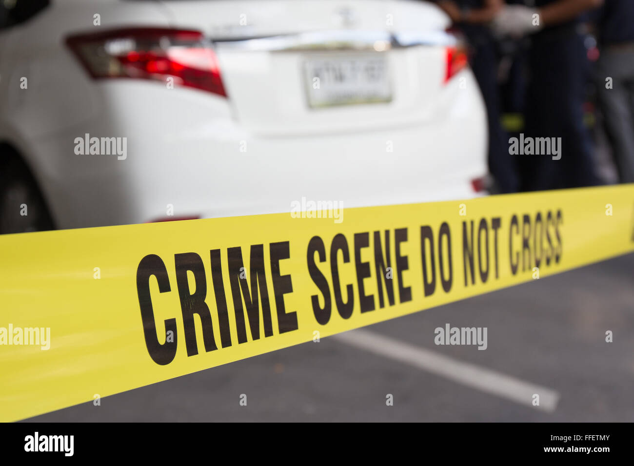 caution tape protect area of crime scene investigation with forensic ...