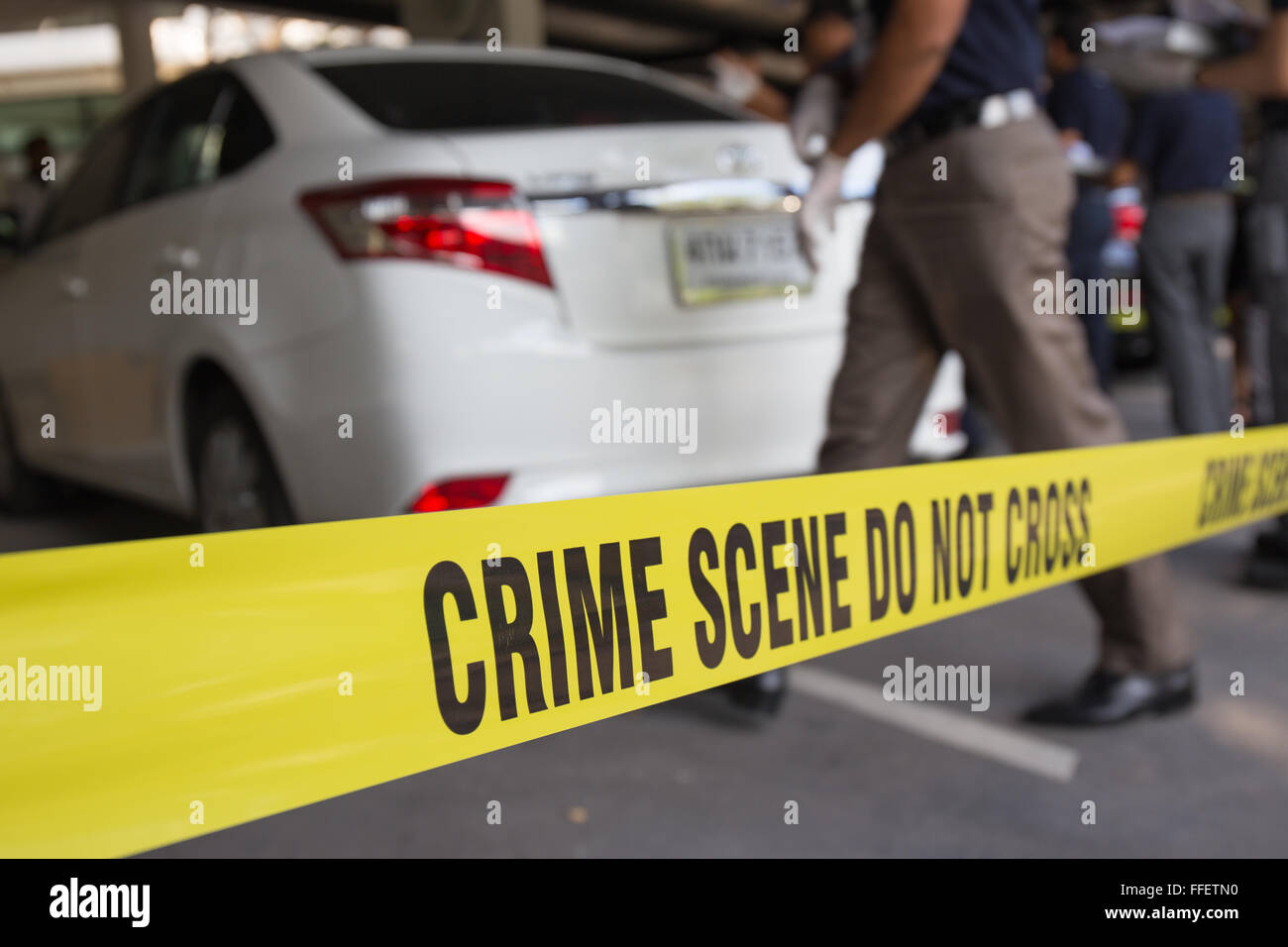 caution tape protect area of crime scene investigation with forensic ...