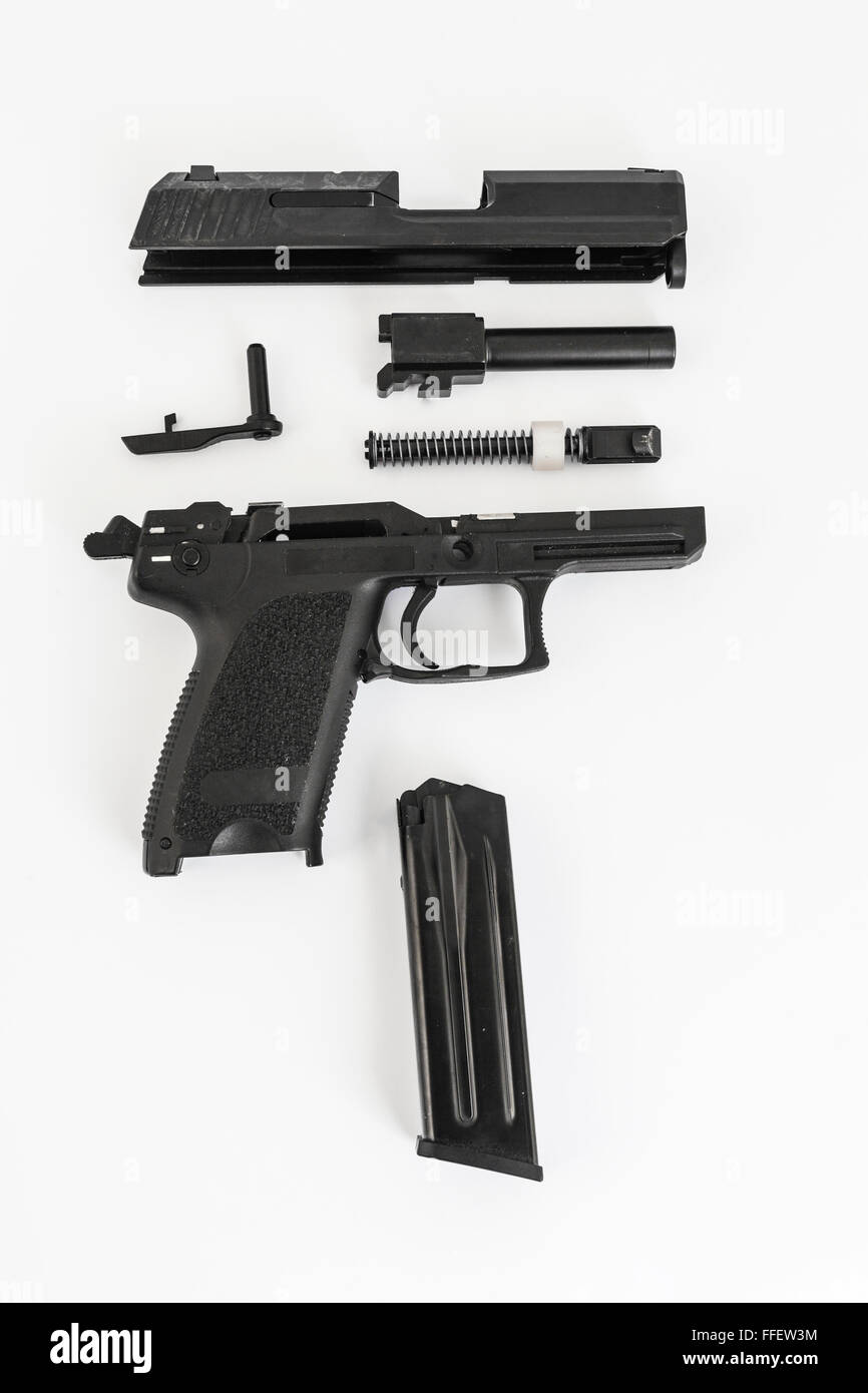disassembled gun, pistol, on white background Stock Photo - Alamy
