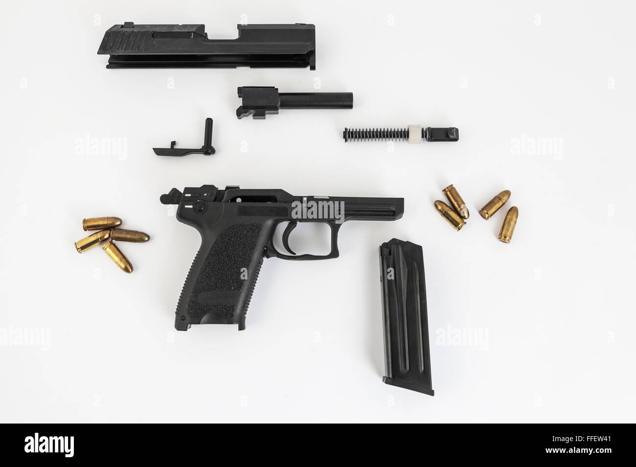 disassembled gun, pistol, on white background Stock Photo - Alamy