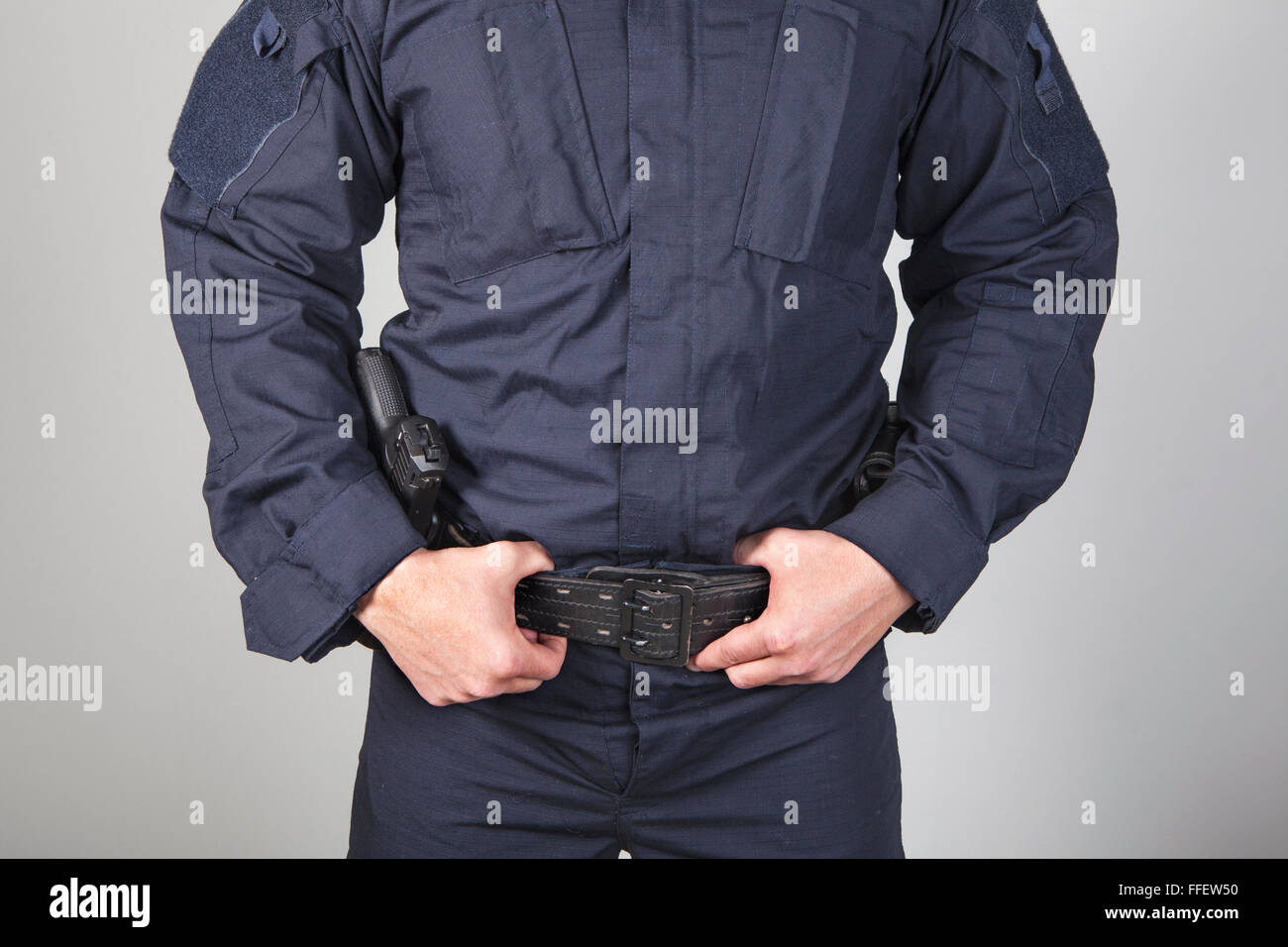 Policeman with gun Stock Photo - Alamy