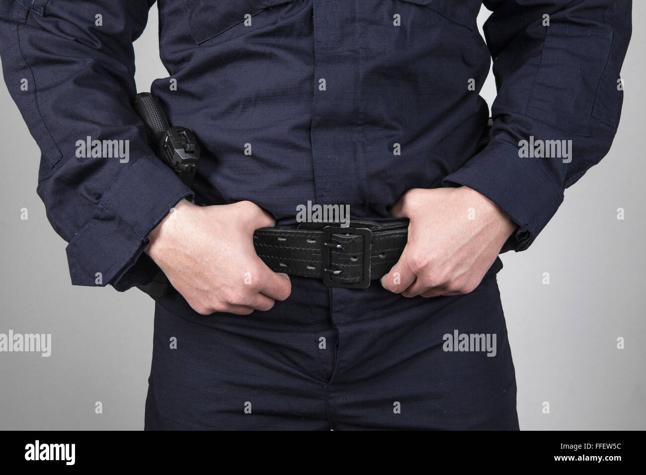 Policeman with gun Stock Photo - Alamy