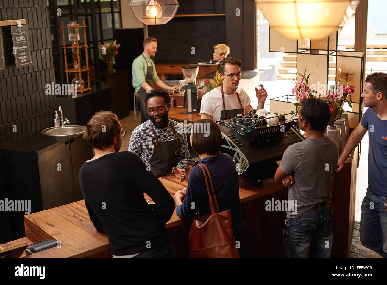 Barista baristas counter customer customers hi-res stock photography ...