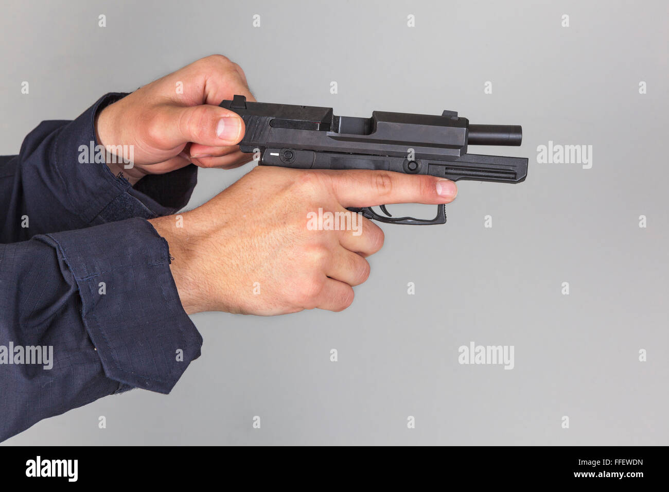 Policeman with gun run out of bullets Stock Photo - Alamy