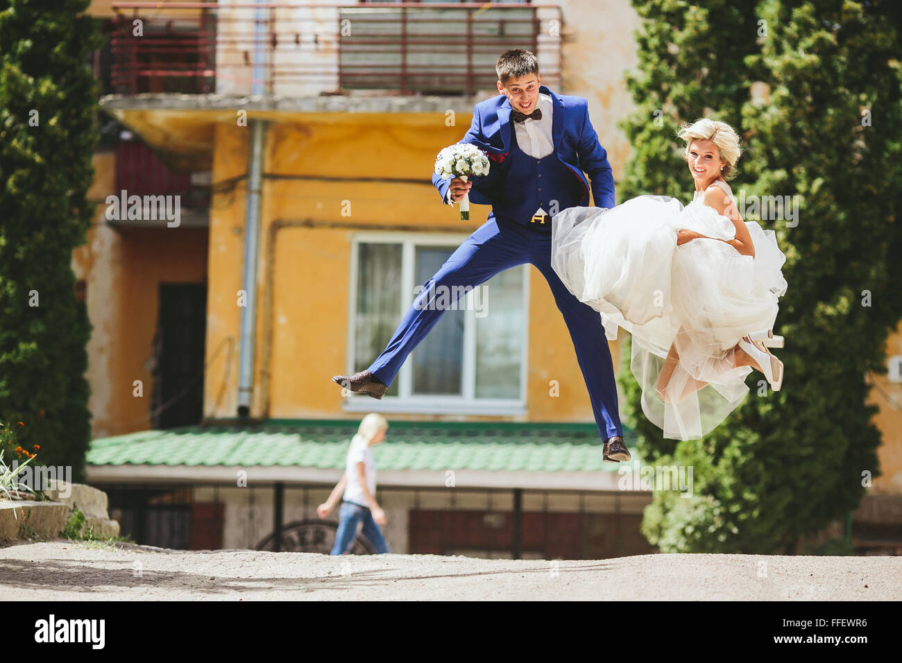 Happy wedding jumping groom hi-res stock photography and images - Alamy