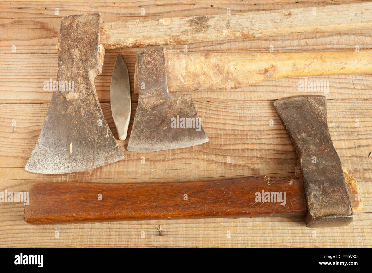 Three dated and used cleavers on wooden background Stock Photo - Alamy