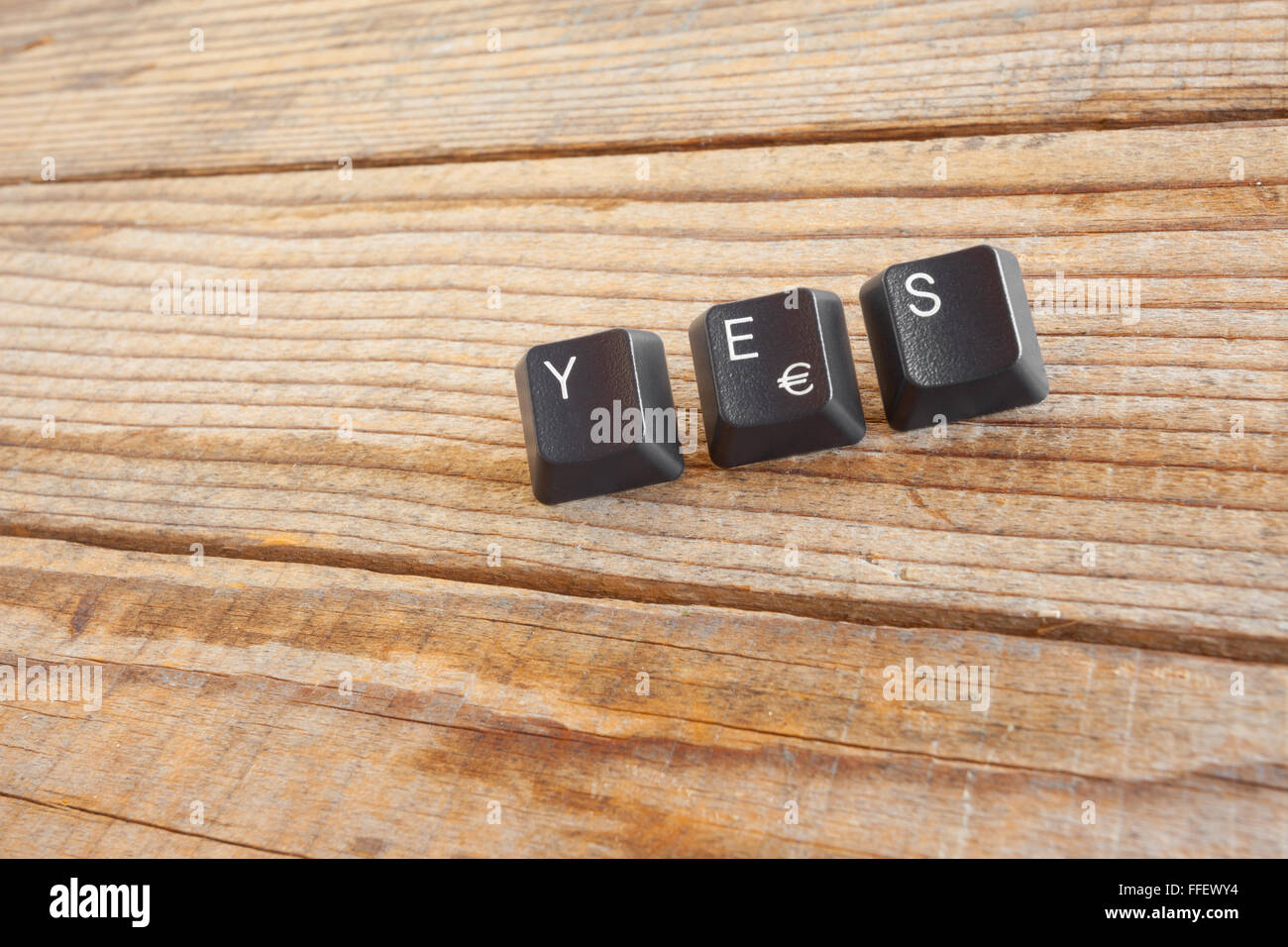 YES wrote with keyboard keys on wooden background Stock Photo - Alamy