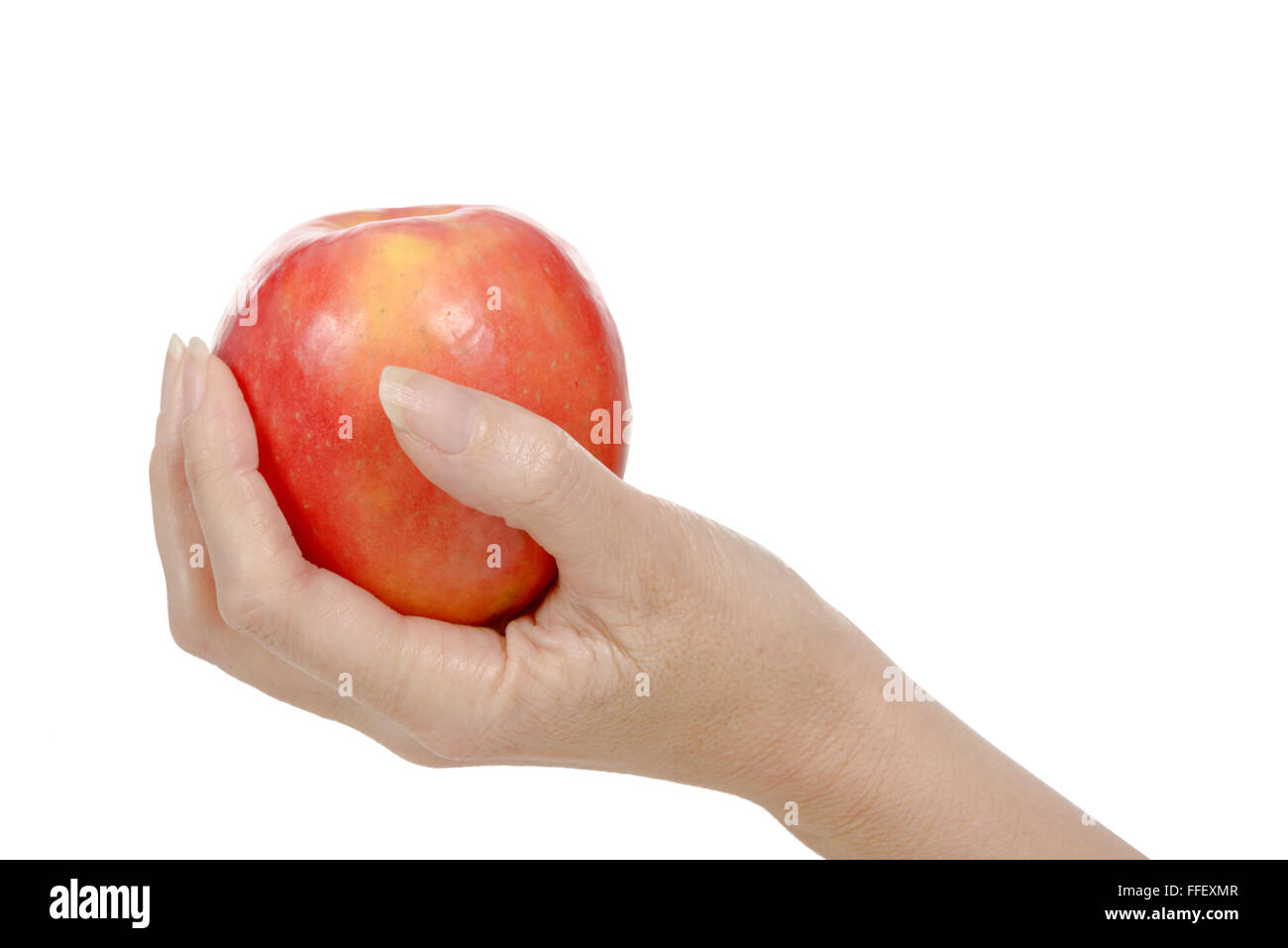 a woman's hand holding red apple. Isolated on a white background Stock ...