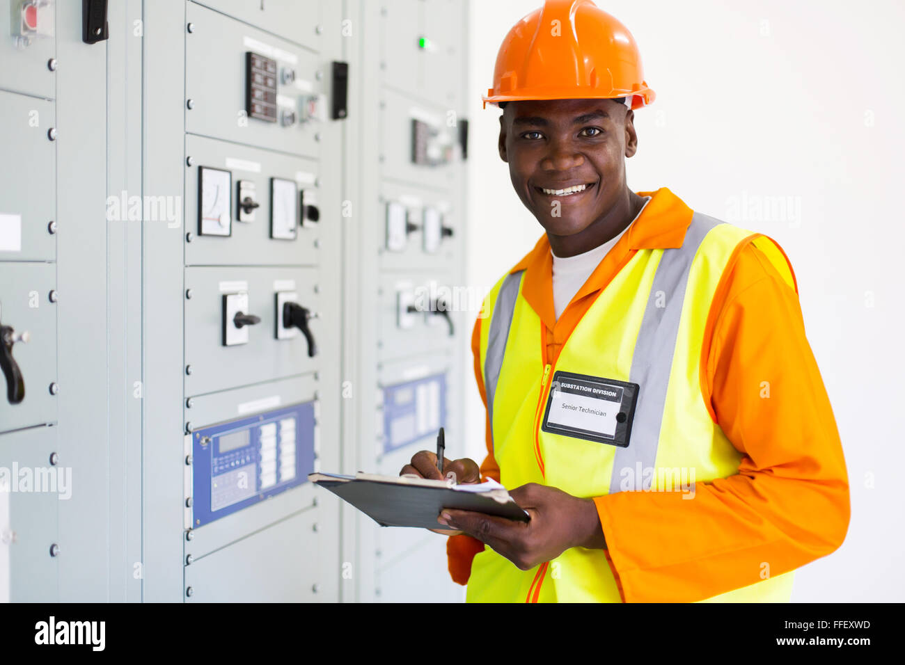 portrait of senior African technician working in control room Stock ...
