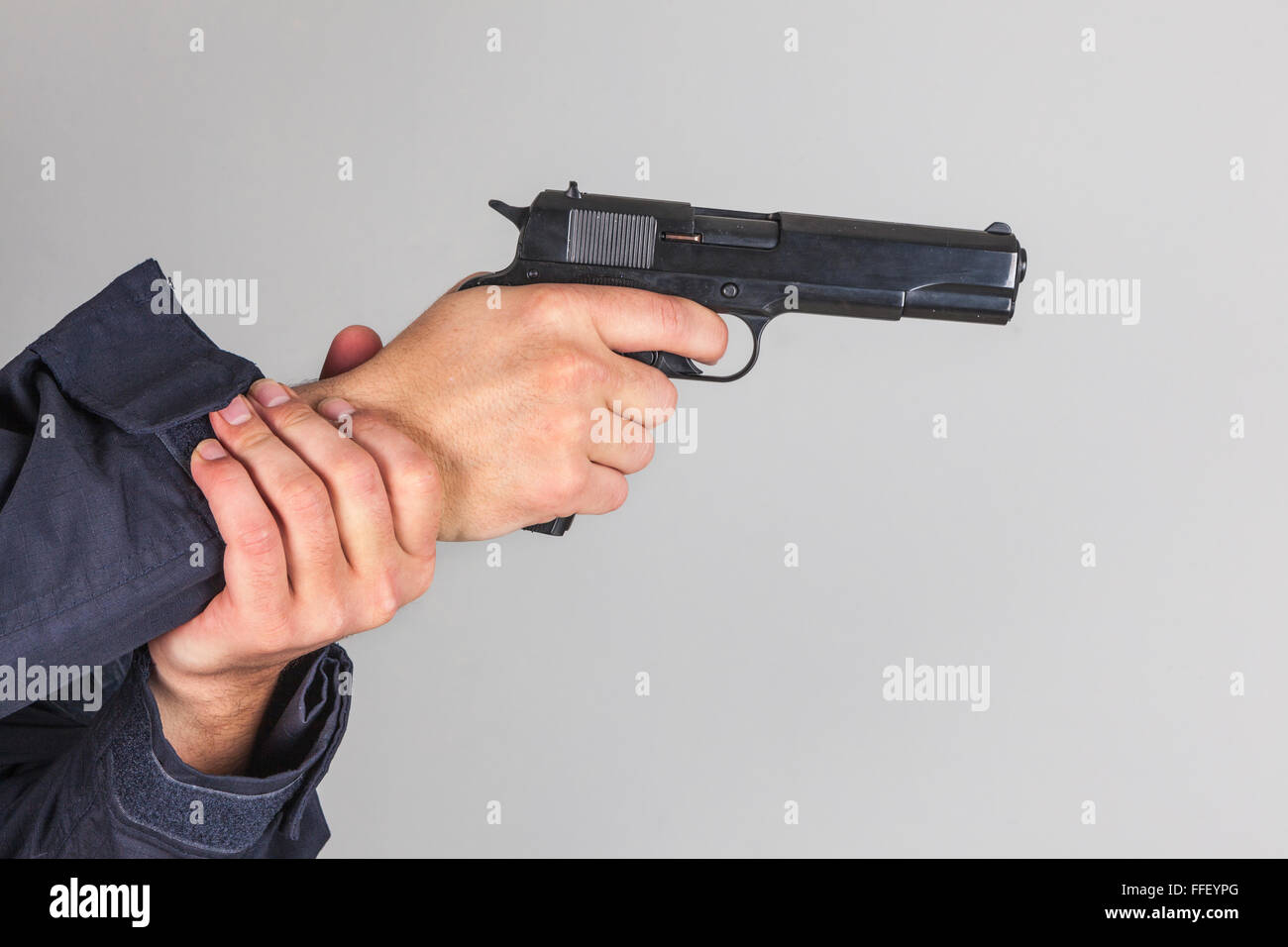 Policeman with gun Stock Photo - Alamy