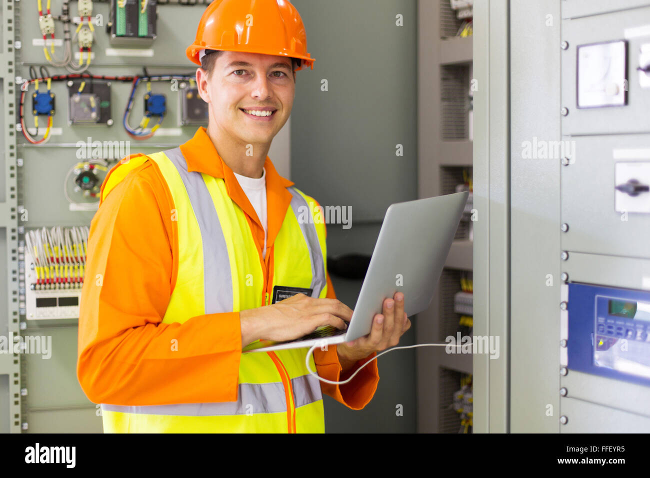 portrait of young technical using laptop computer Stock Photo - Alamy