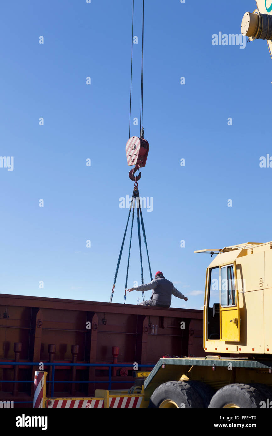 Container Cargo freight ship with working crane bridge in shipyard ...