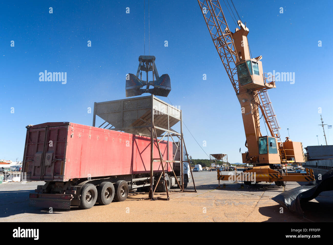 Container Cargo freight ship with working crane bridge in shipyard ...