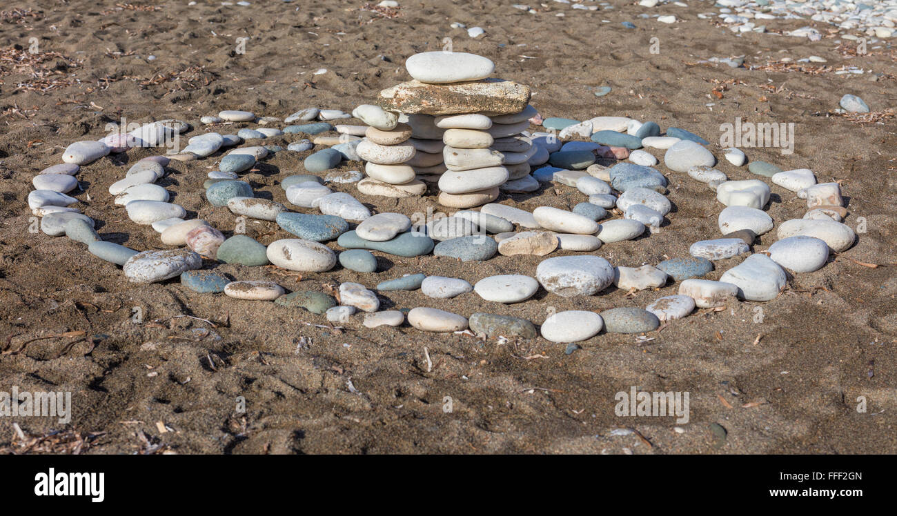 Stone pyramid at the beach, Petra tou Romiou (Rock of the Greek ...