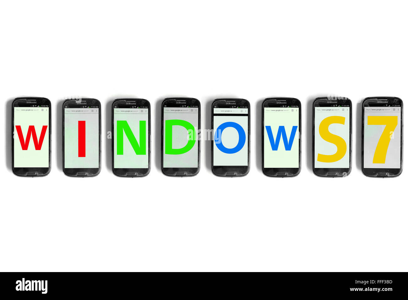 Windows 7 written on the screens of smartphones photographed against a ...