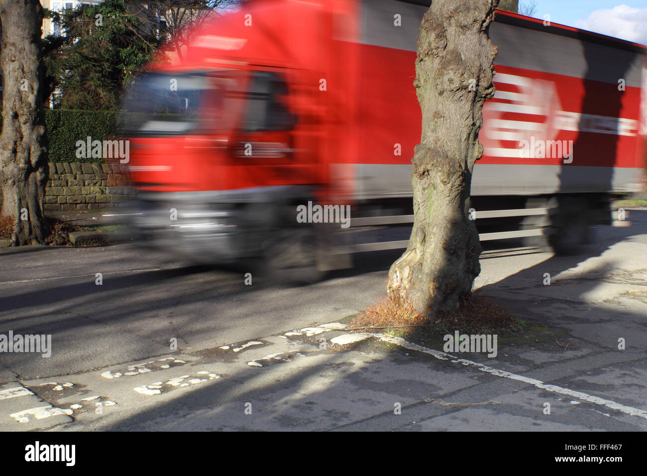 Lorry drives tree growing in hi-res stock photography and images - Alamy