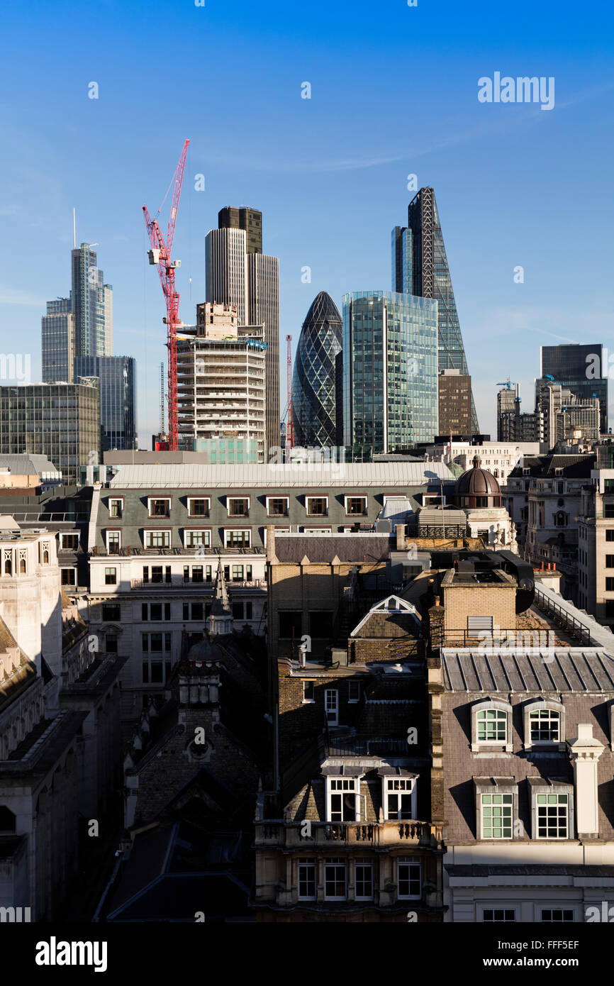City of London on sunny day from elevated position with sun and blue ...