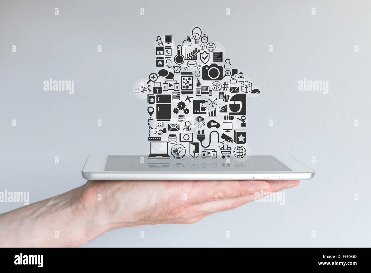 Smart home automation concept with hand holding tablet Stock Photo - Alamy
