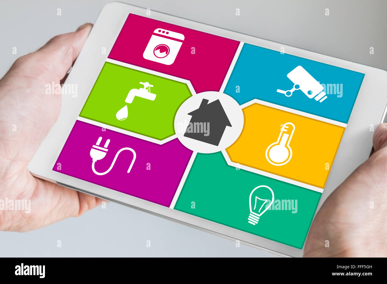 Smart home automation and mobile computing concept. Hands holding ...