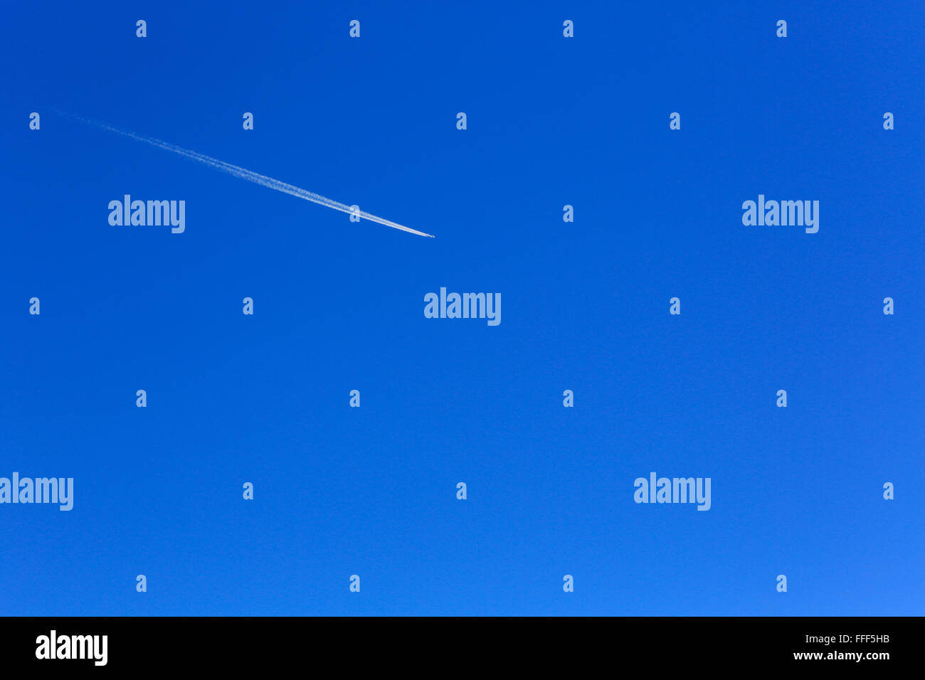 Natural blue sky with airplane trace background Stock Photo - Alamy