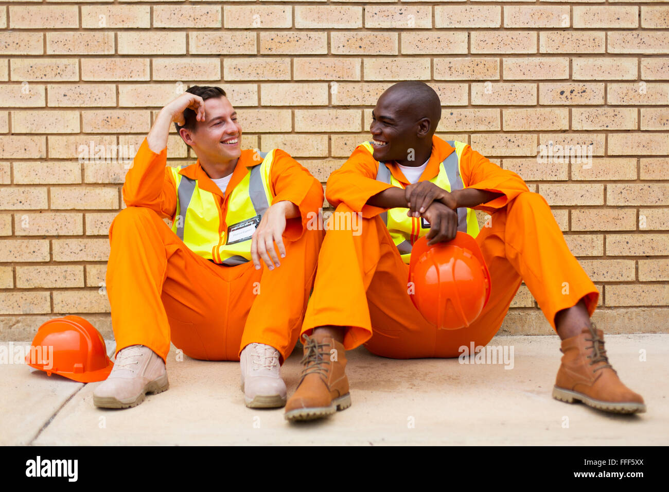 happy power company co-workers chatting during break Stock Photo - Alamy