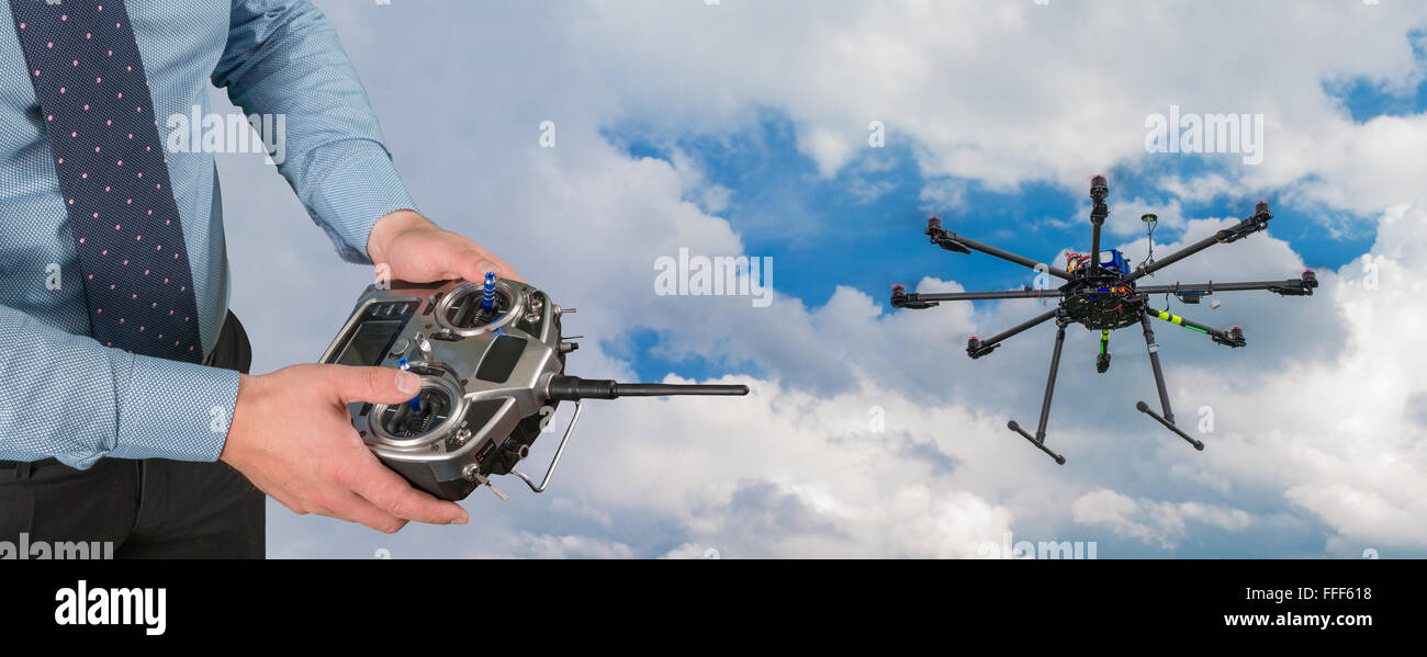 Multicopter in flight on sky and clouds background Stock Photo - Alamy
