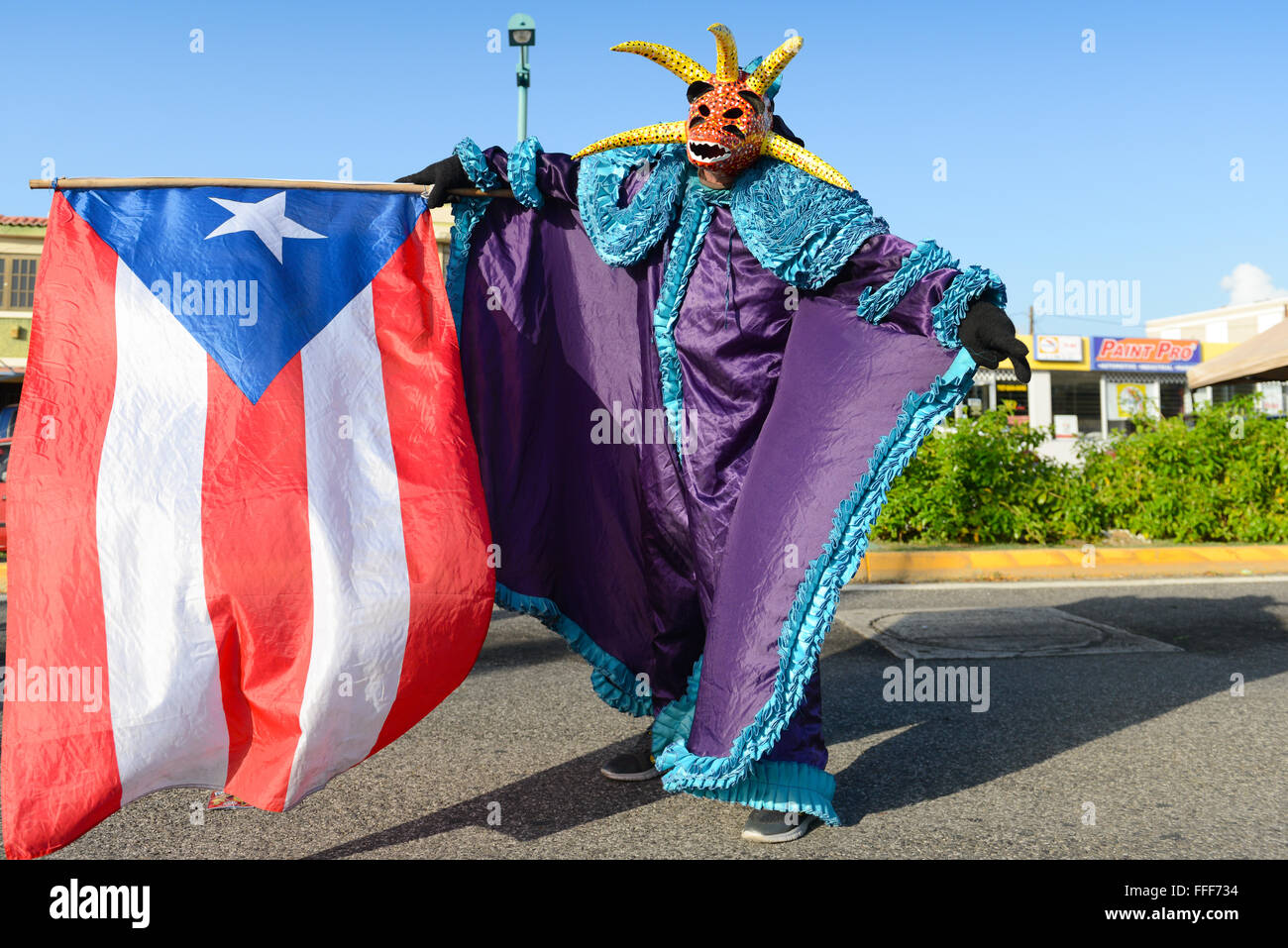 Traditional cultural figure VEJIGANTE posing with flag during the ...
