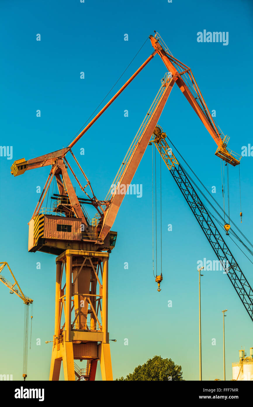 Business and commerce. Heavy load dockside cranes in port, cargo ...