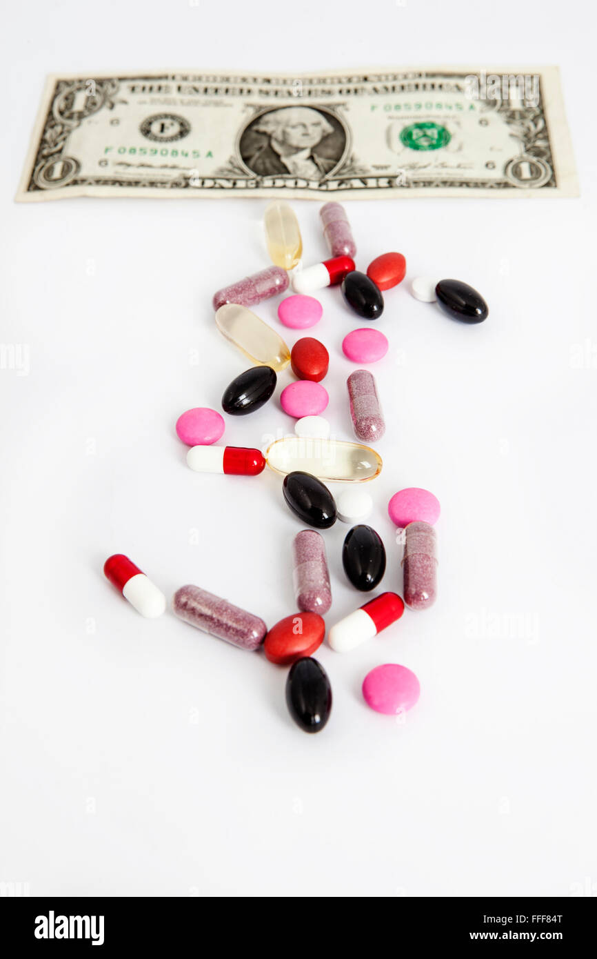 Dollar currency symbol made of colorful pills on white background Stock ...