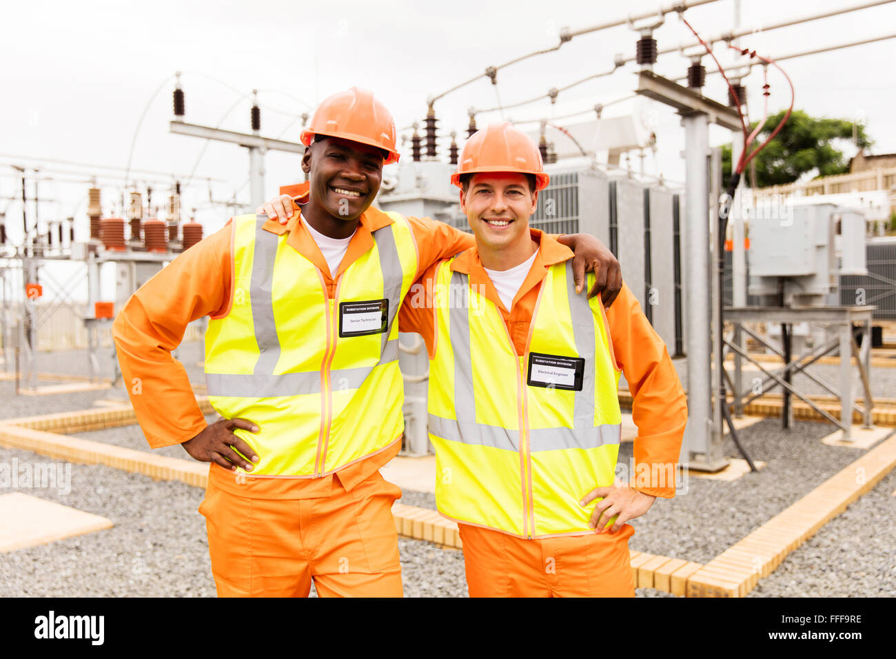 handsome electrical engineers standing in power plant Stock Photo - Alamy