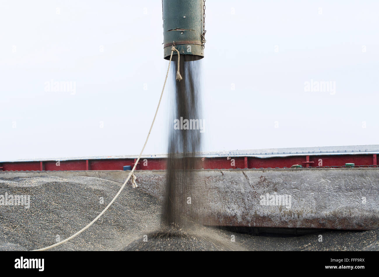 Big hooper on ship port under sunlight Stock Photo - Alamy