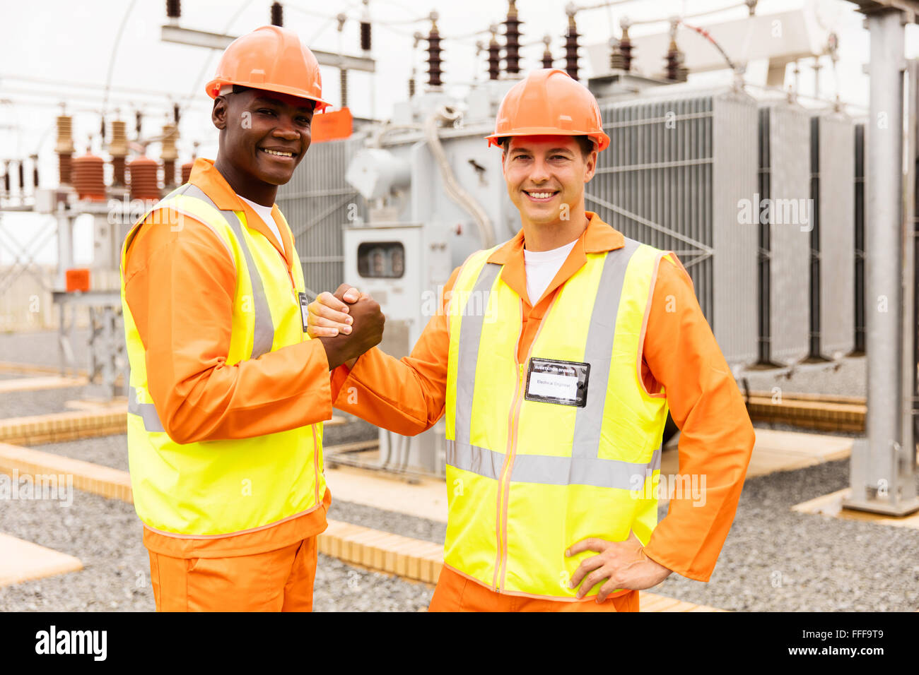 portrait of electrical engineers working together in substation Stock ...