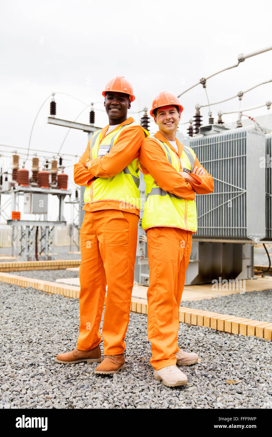 multiracial electrical co-workers in electric substation Stock Photo ...