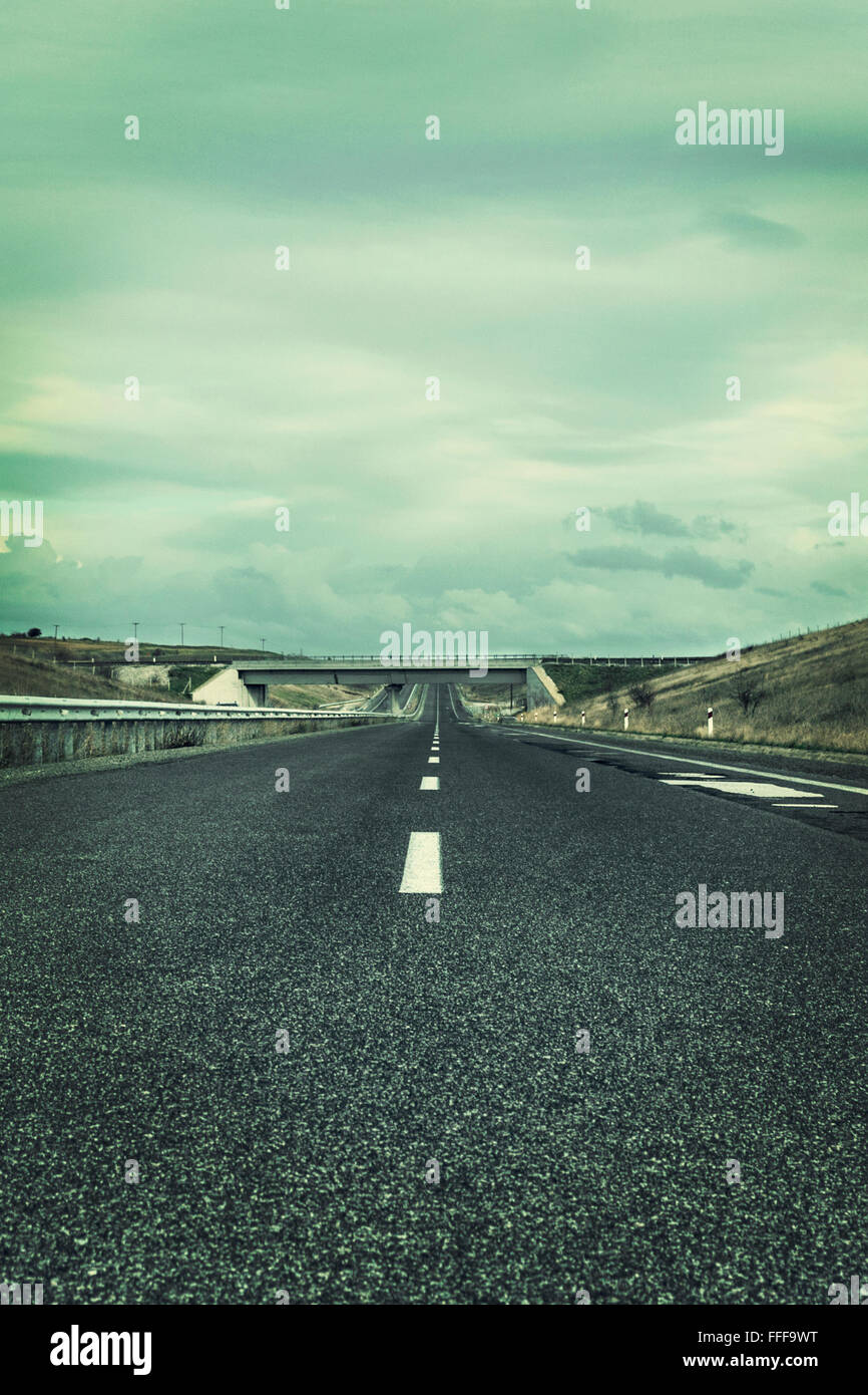 Vintage photo. Highway road without traffic in daylight Stock Photo - Alamy