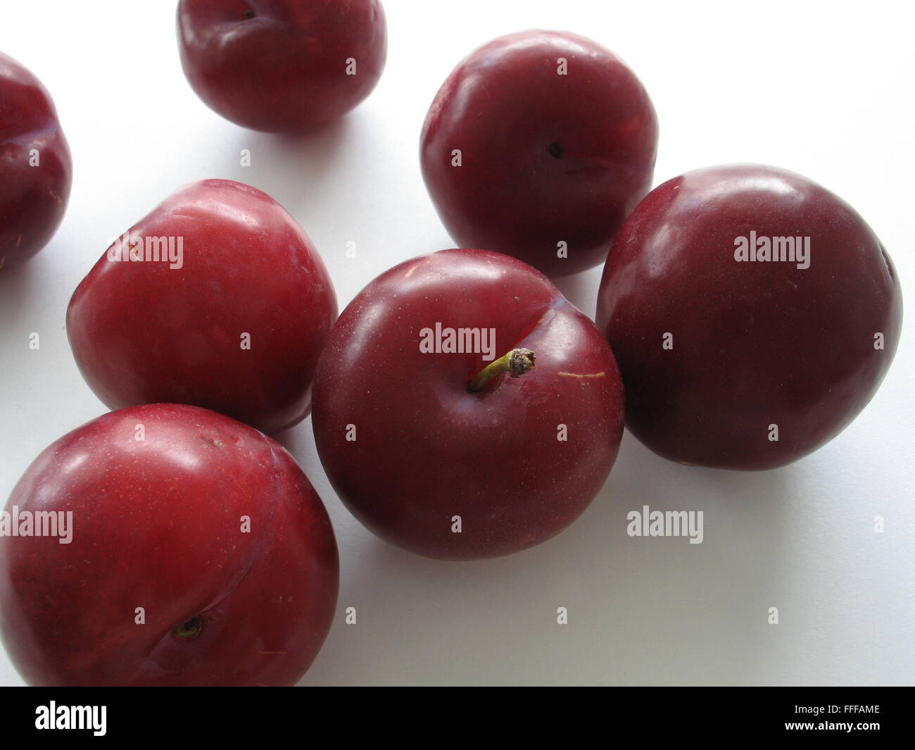 some plums on a table Stock Photo - Alamy