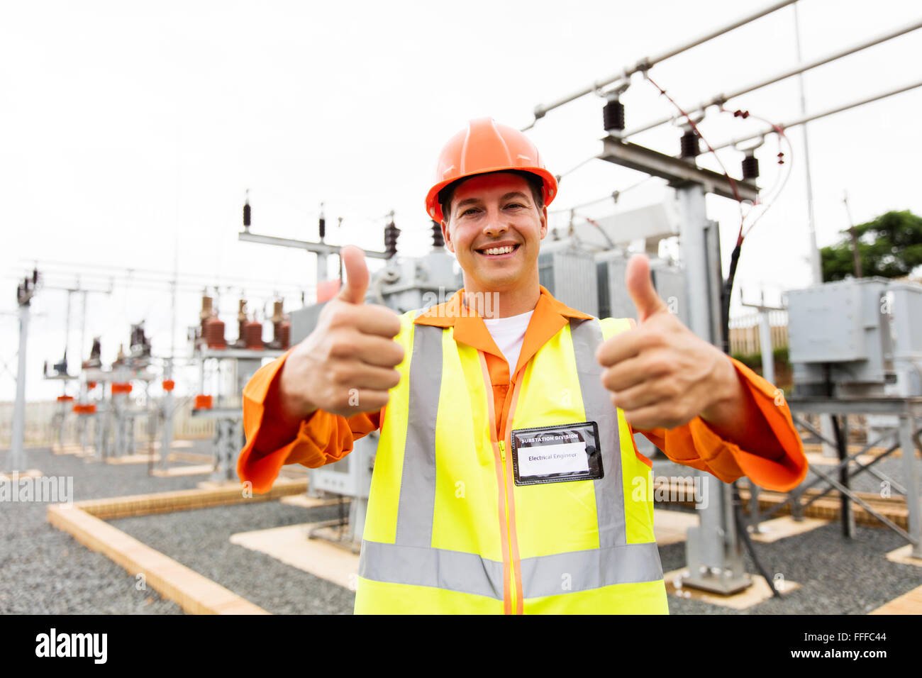 handsome electrician with thumbs up at substation Stock Photo - Alamy