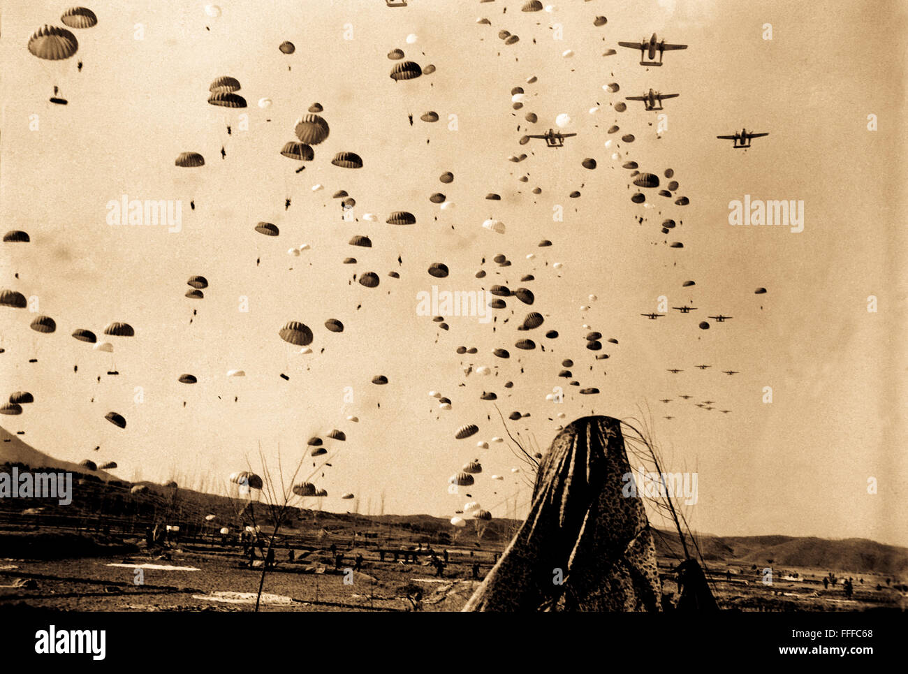 Paratroopers of the 187th RCT (Regimental Combat Team) float earthward ...