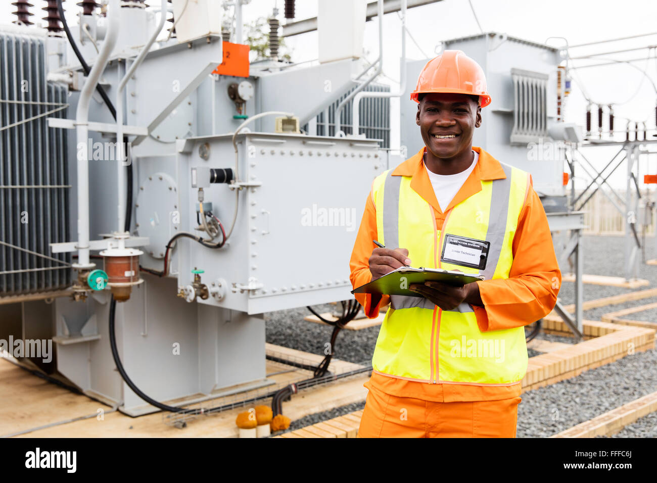 African technical worker working at power plant Stock Photo - Alamy