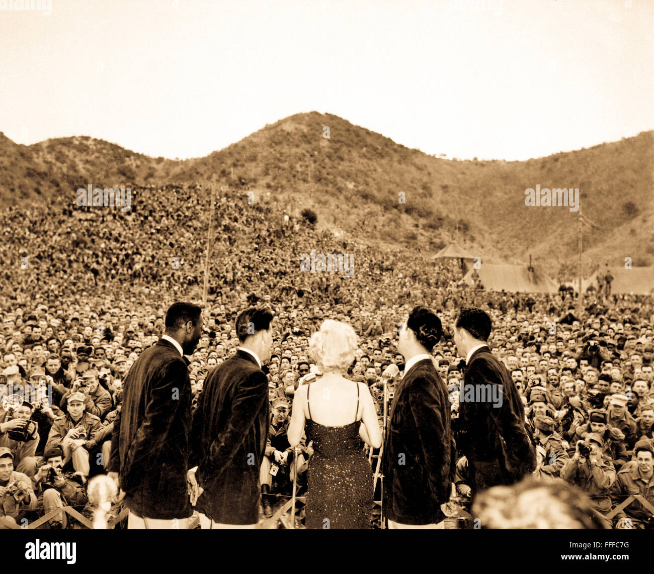 Marilyn Monroe sings several songs for an estimated 13,000 men of the ...