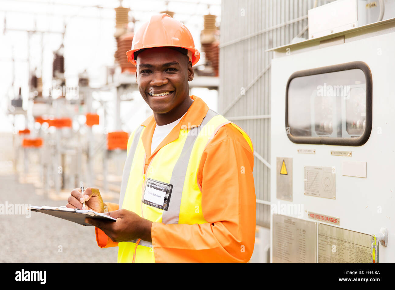 senior technician holding clipboard in substation Stock Photo - Alamy