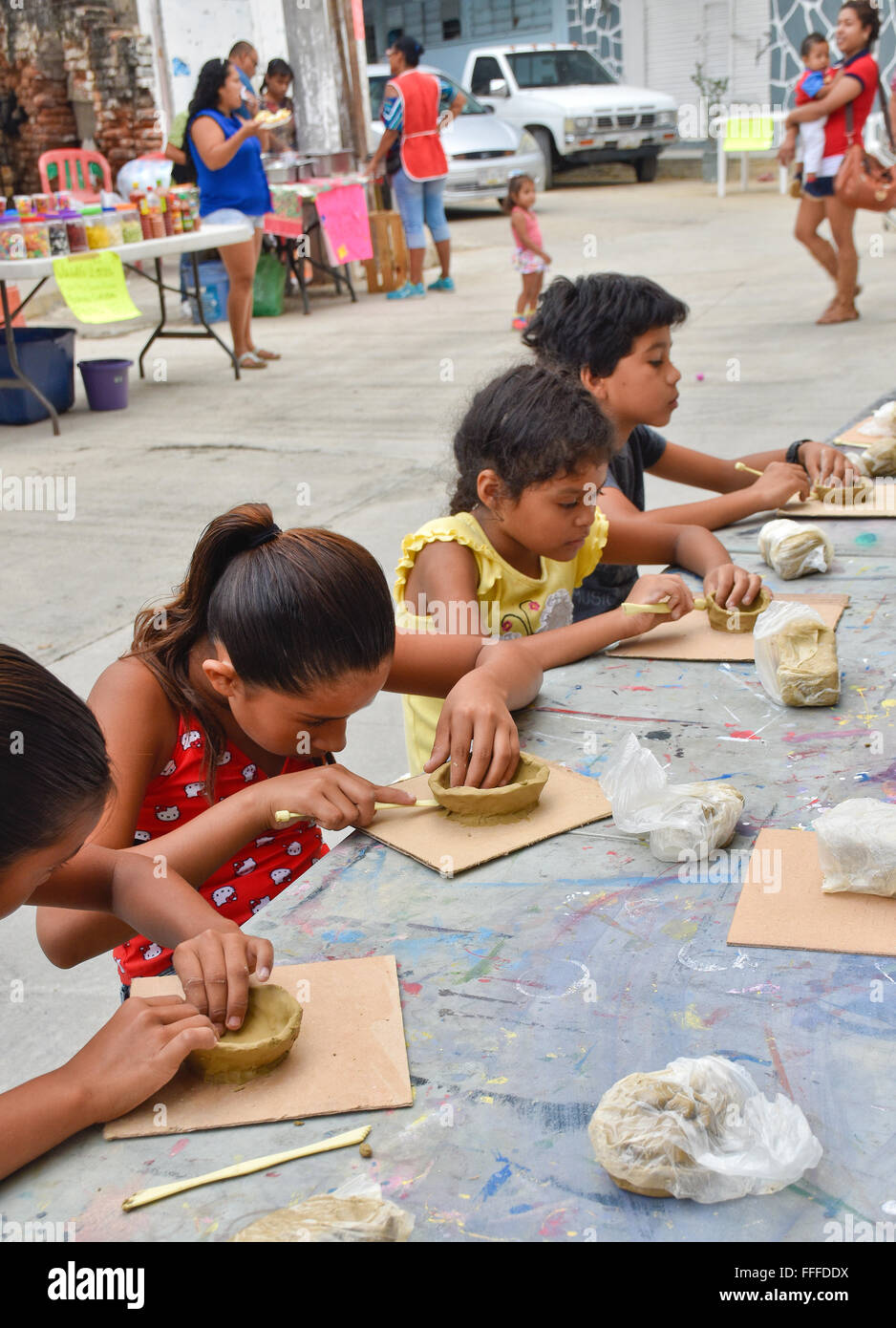 Children making art projects at a local government cultural event in ...