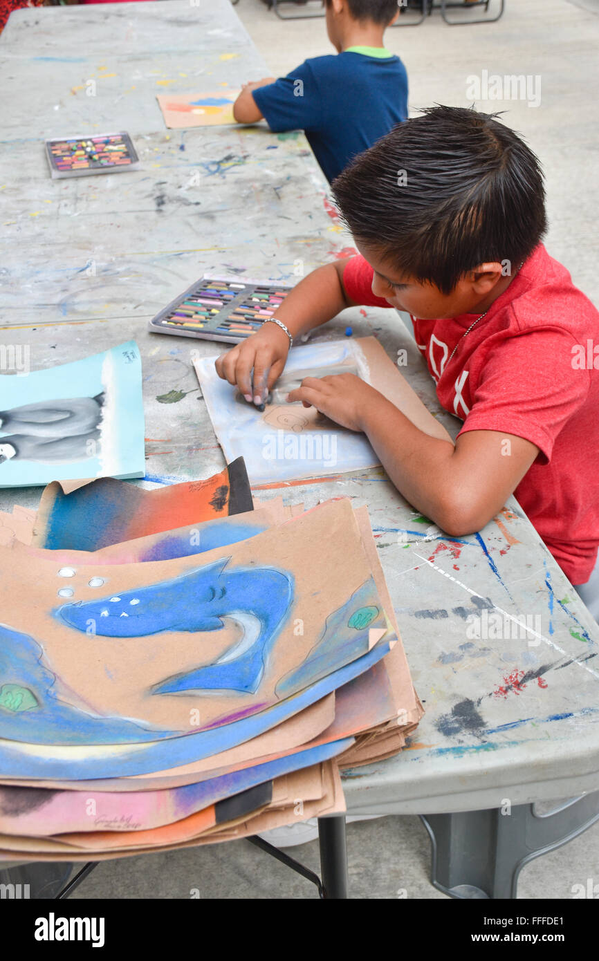 Children making art projects at a local government cultural event in ...