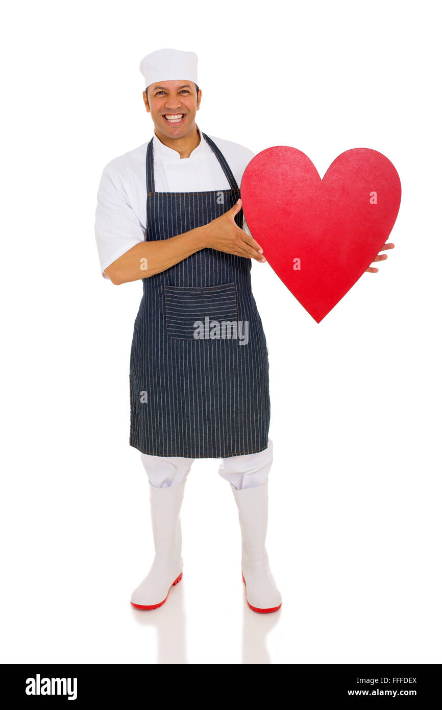 happy middle aged chef holding heart shape on white background Stock ...