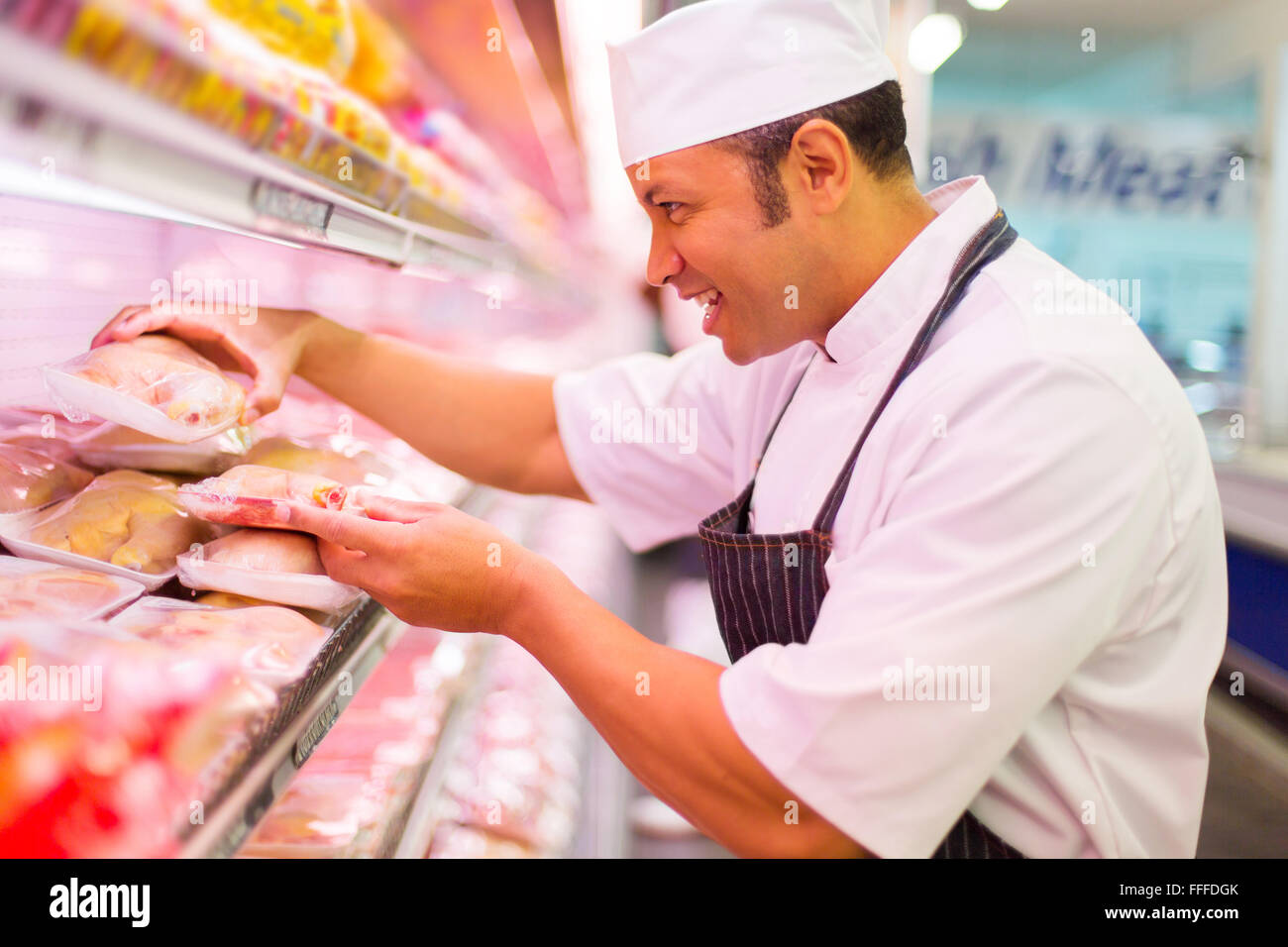 happy middle aged butcher working in butchery Stock Photo - Alamy