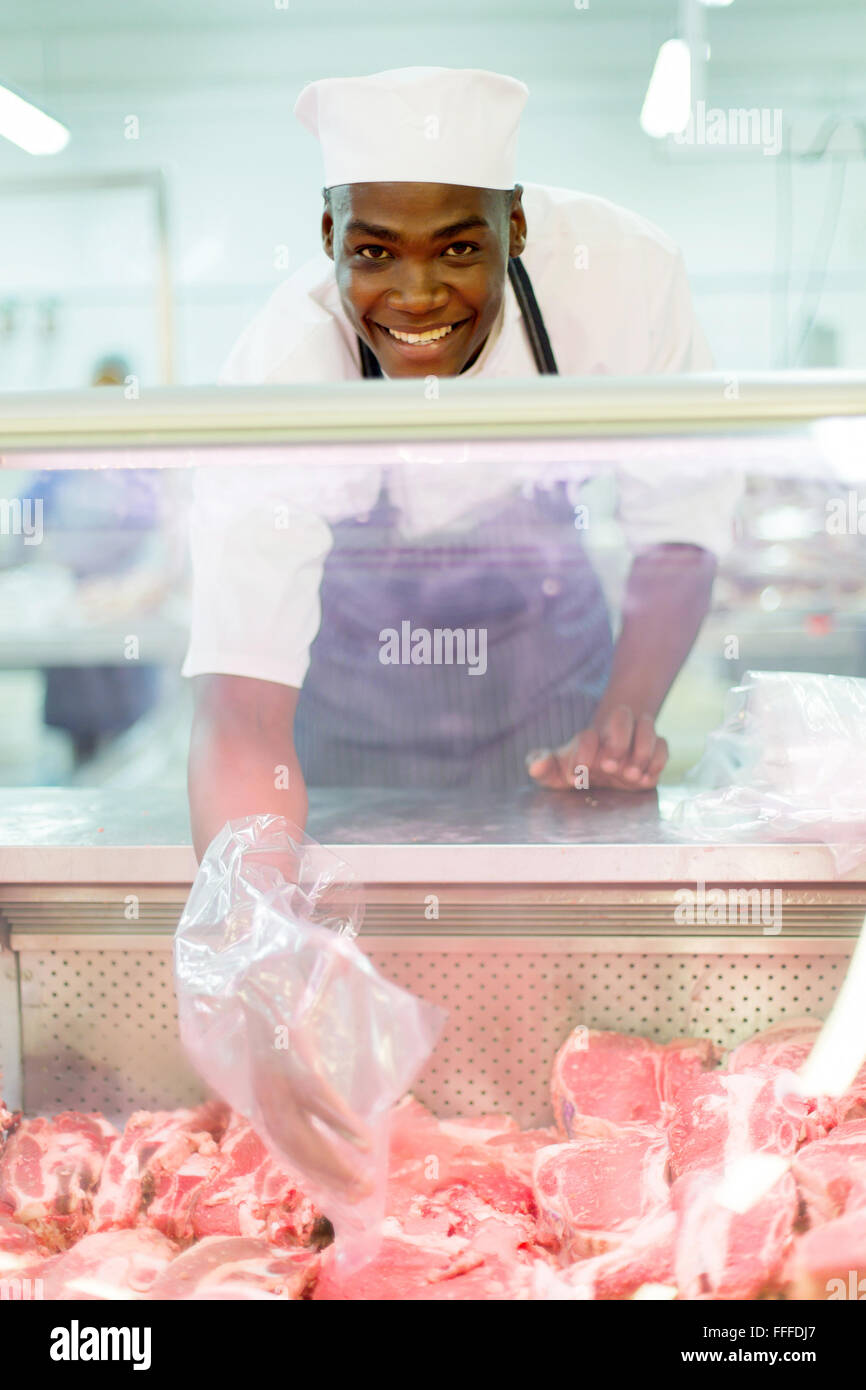 happy young African butcher helping customer Stock Photo - Alamy