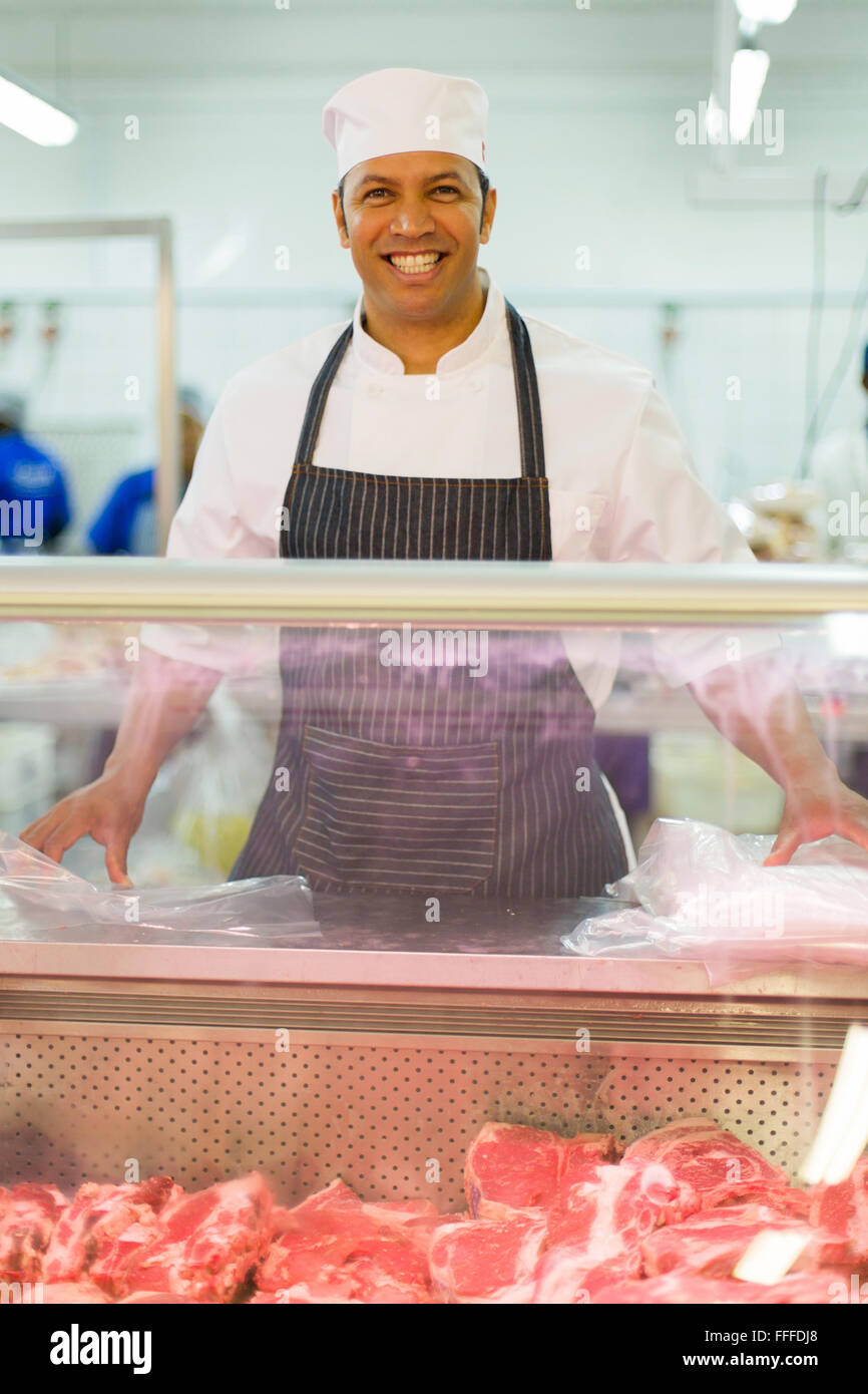 portrait of handsome mature butcher standing in butchery Stock Photo ...