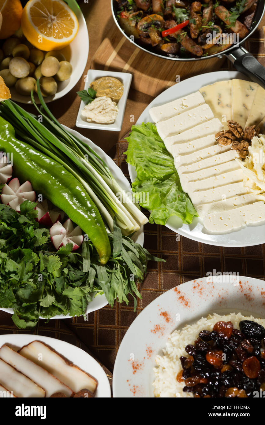 table with normal food, steaks and potatoes Stock Photo - Alamy