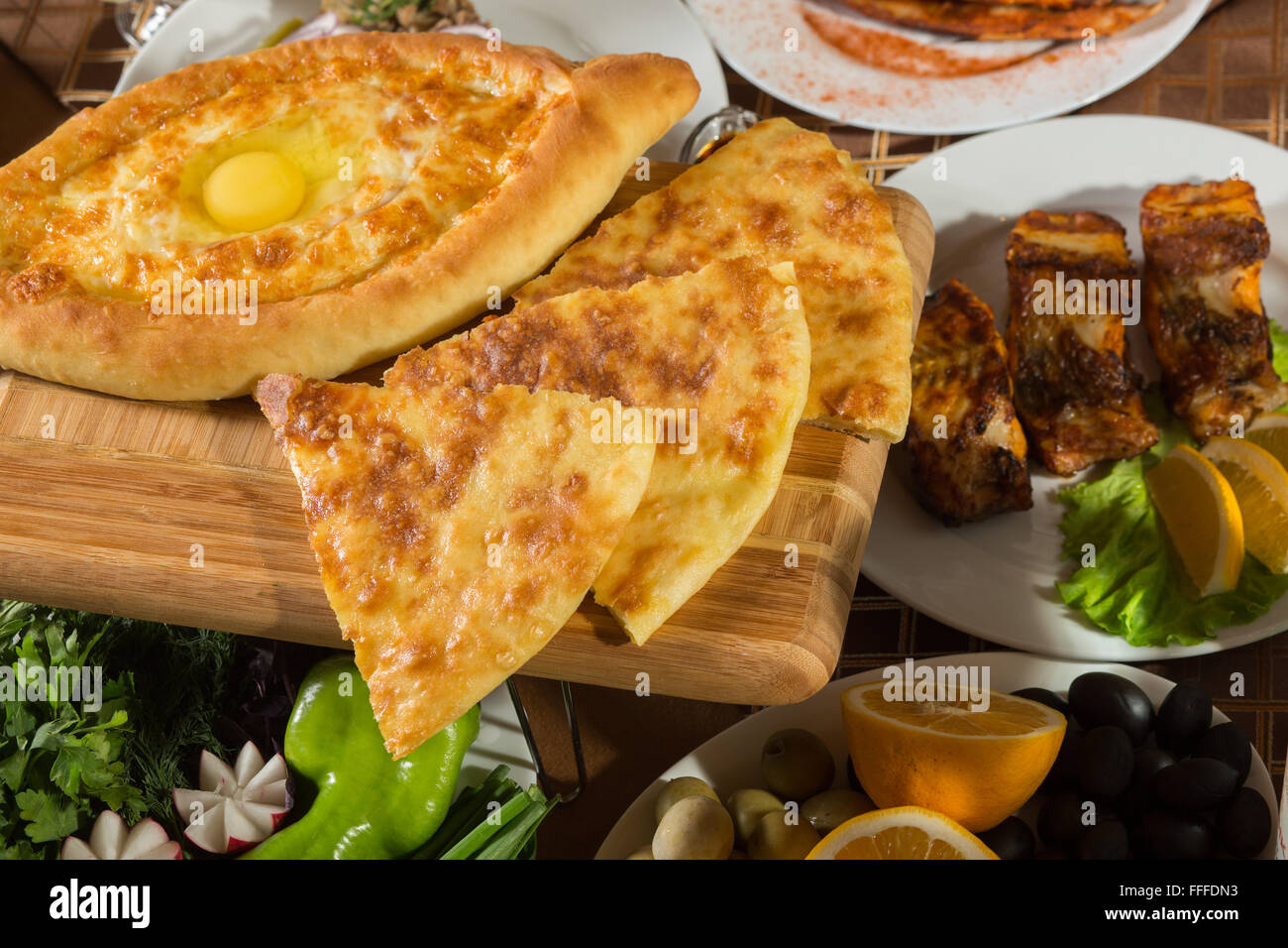 table with normal food, steaks and potatoes Stock Photo - Alamy
