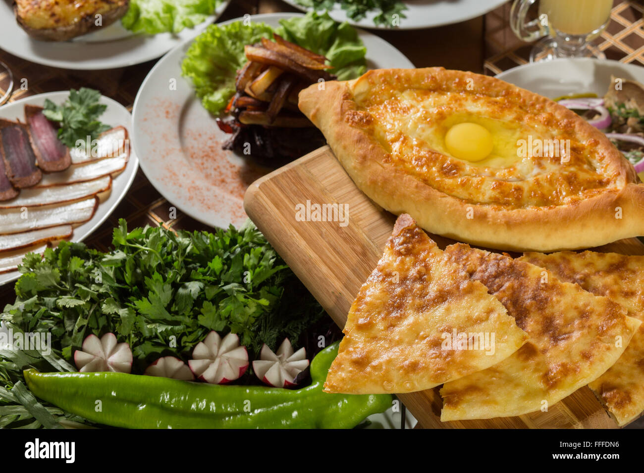 table with normal food, steaks and potatoes Stock Photo - Alamy