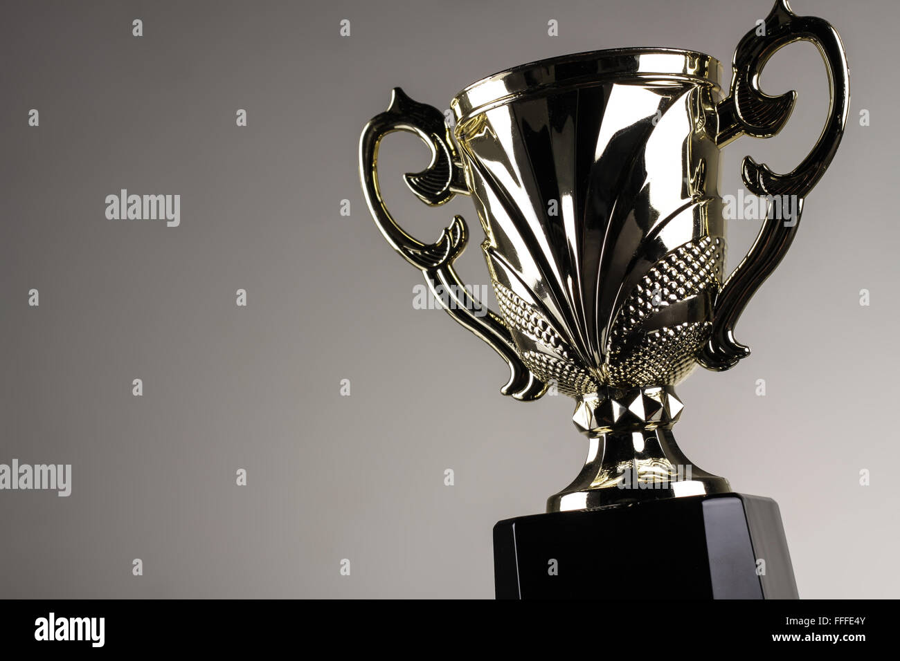 Trophy shoot in the black background in the studio Stock Photo - Alamy